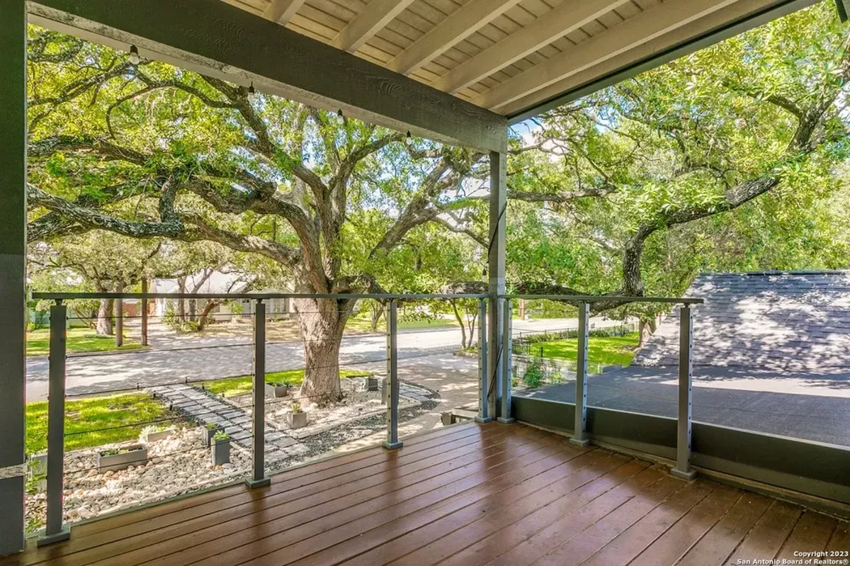 This San Antonio home comes with a two-story library featuring etched ...